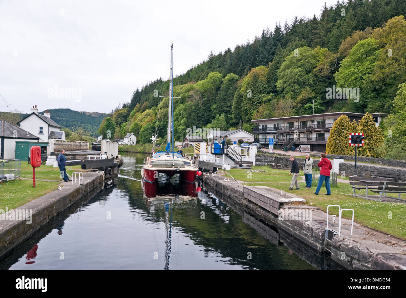A Sailing vessel is passing through a lock on the Crinan Canal at ...