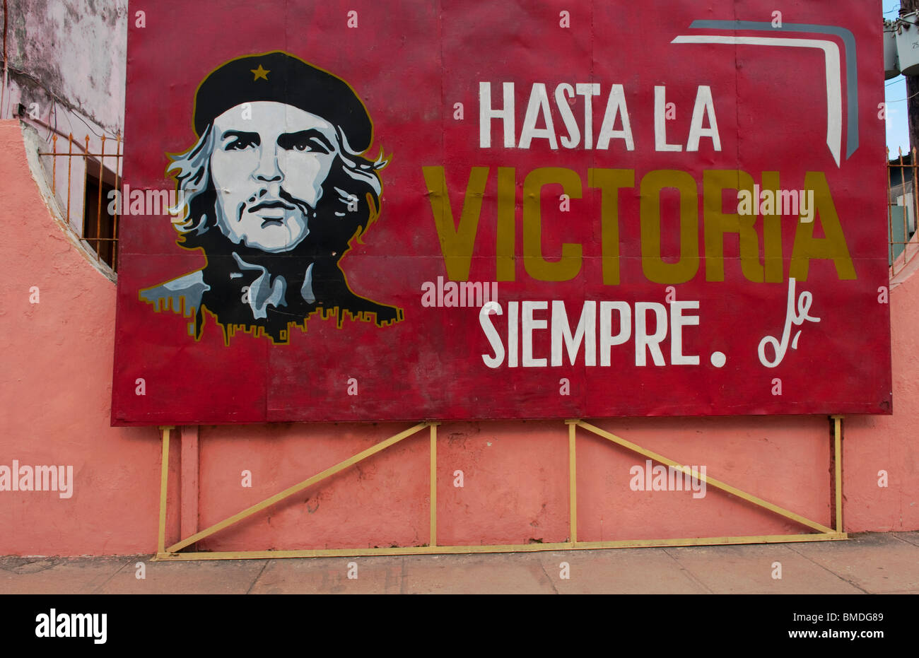 Colorful red billboard in street of Cardenas Cuba showing hero Che in ...
