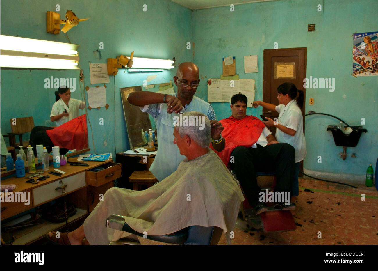 Small local barbershop with barber cutting hair in small town of ...
