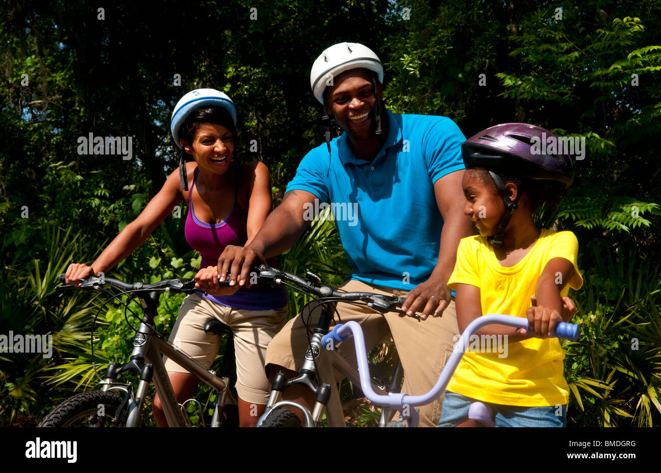 Black African American family teaching their 6 year old daughter to ...