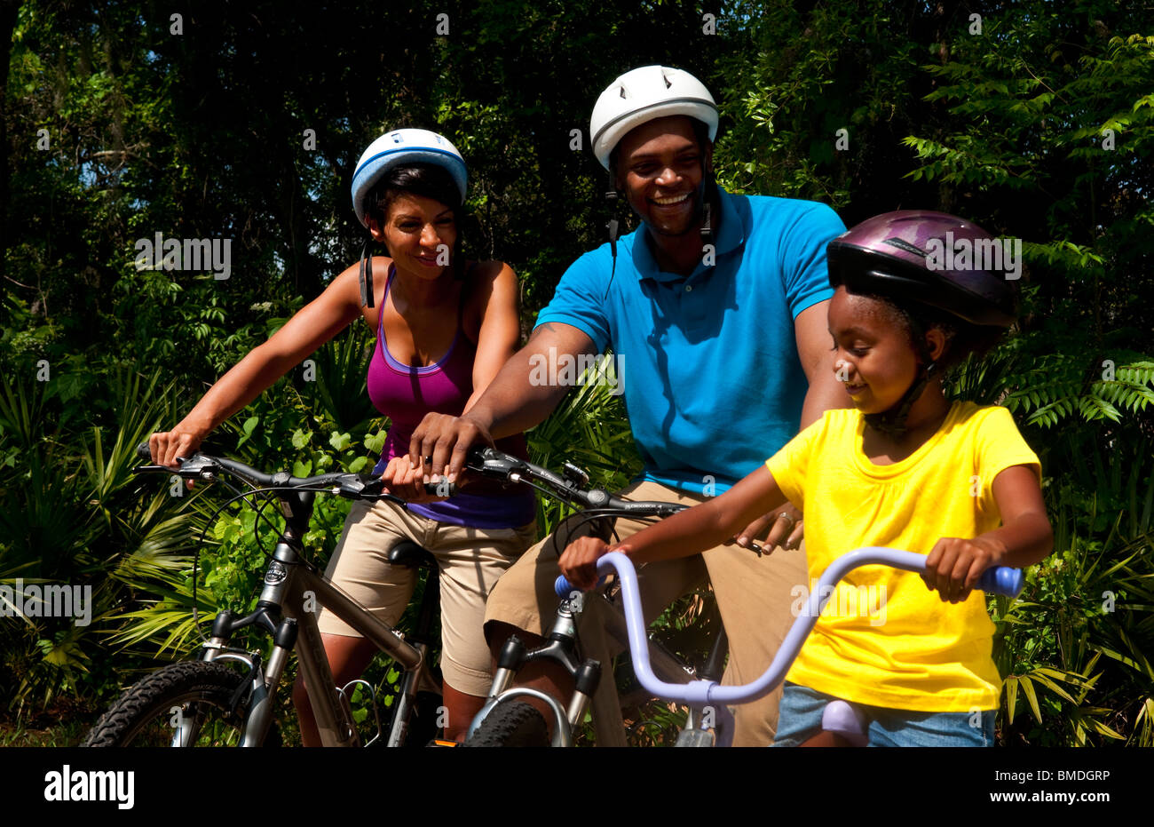 Black African American family teaching their 6 year old daughter to ...