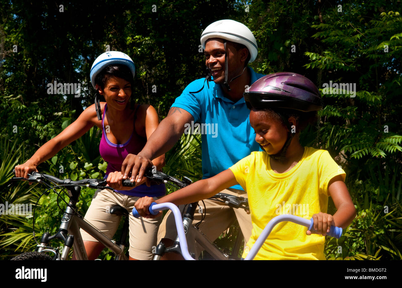 Black African American family teaching their 6 year old daughter to ...