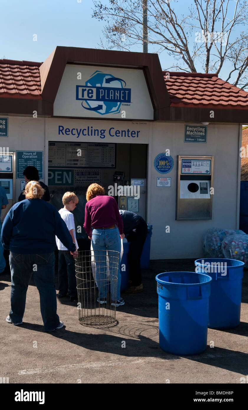 People recycling aluminium cans in Recycling Center in Re Planet store ...