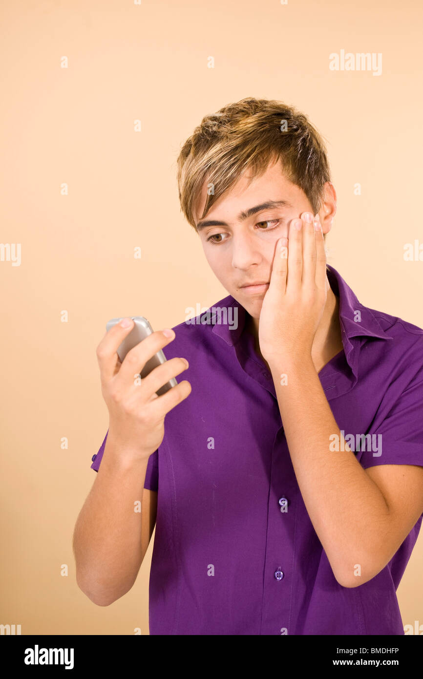 Teenage Boy with Cell Phone Stock Photo - Alamy