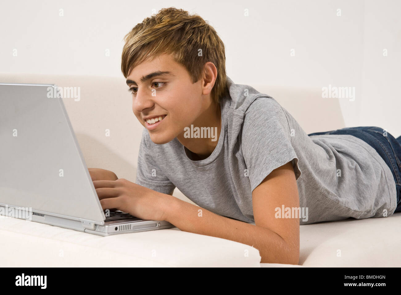 Teenage Boy Using Laptop Stock Photo - Alamy
