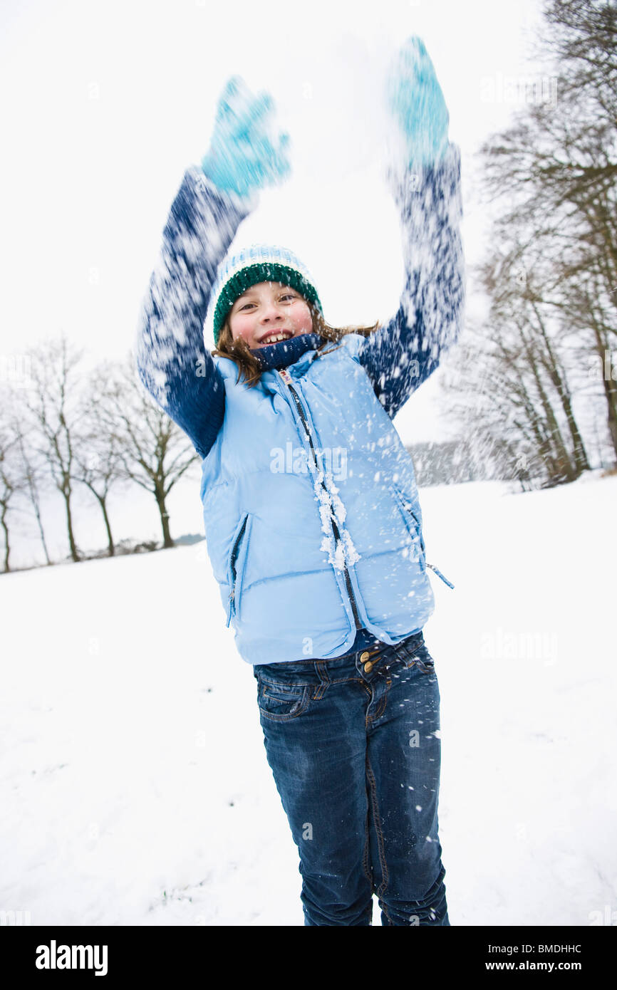 Girl Throwing Snow Outdoors Stock Photo - Alamy