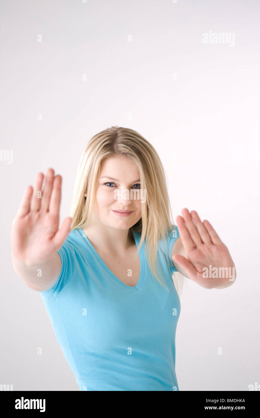 Woman Holding Hands up to Camera Stock Photo - Alamy