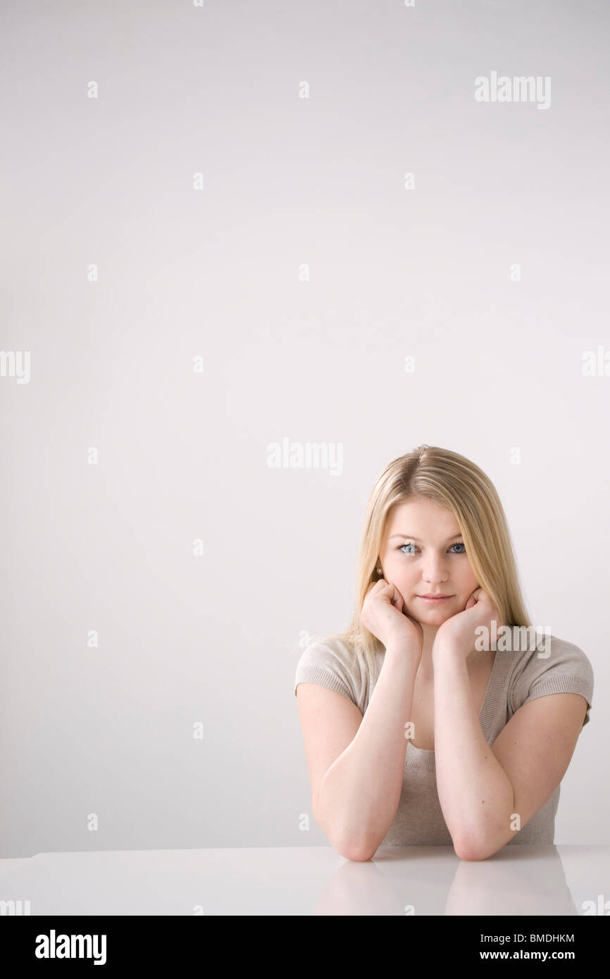 Woman Leaning on Elbows Stock Photo - Alamy