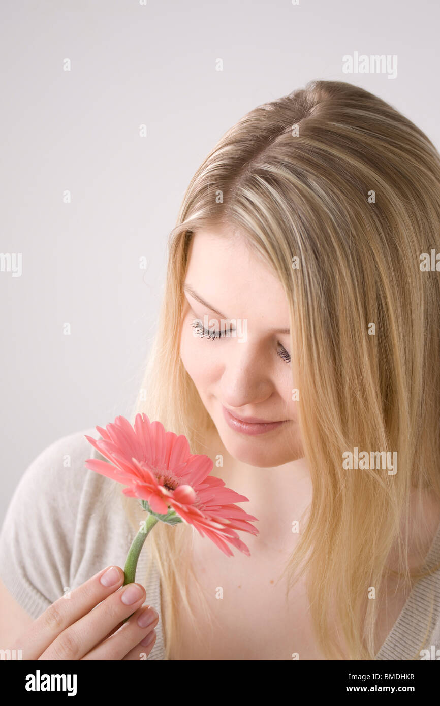 Woman Smelling Flower Stock Photo - Alamy