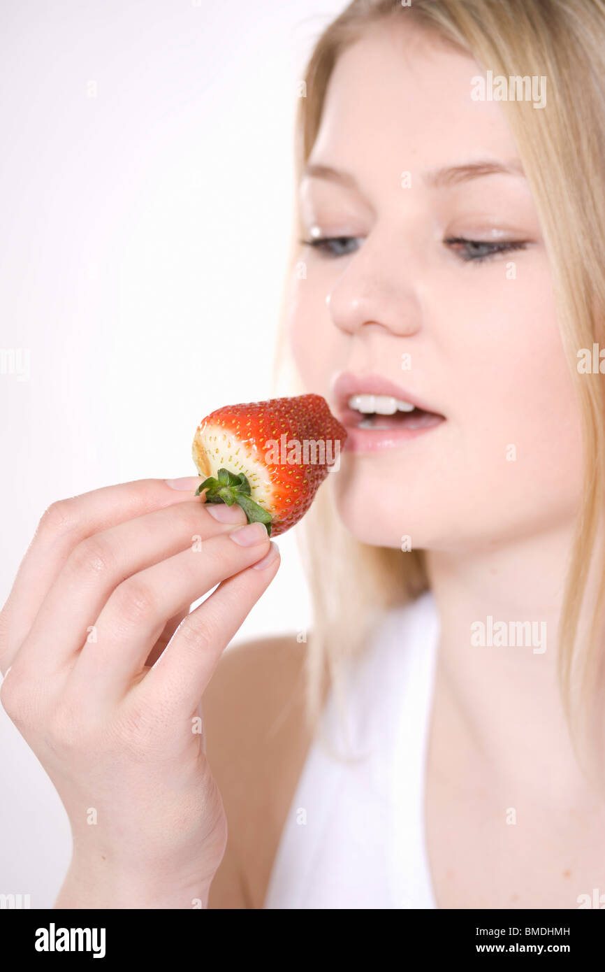 Woman Eating Strawberry Stock Photo - Alamy