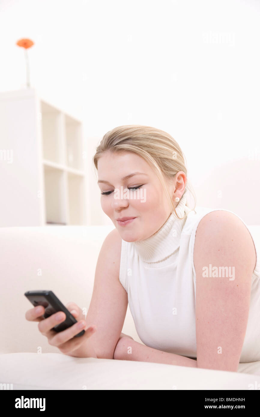 Woman smirk sms hi-res stock photography and images - Alamy