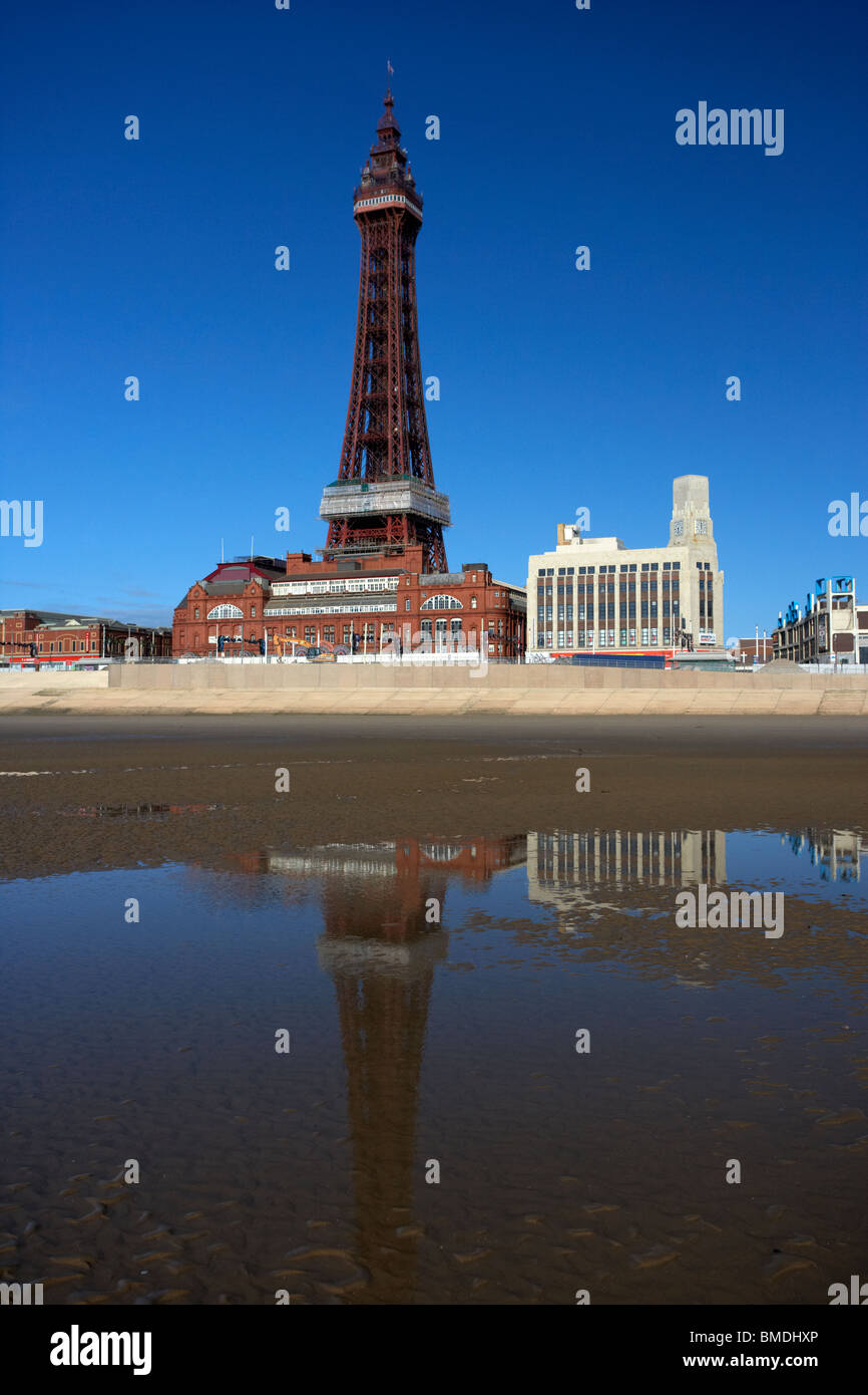 reflection of Blackpool tower and seafront promenade in pool on the ...