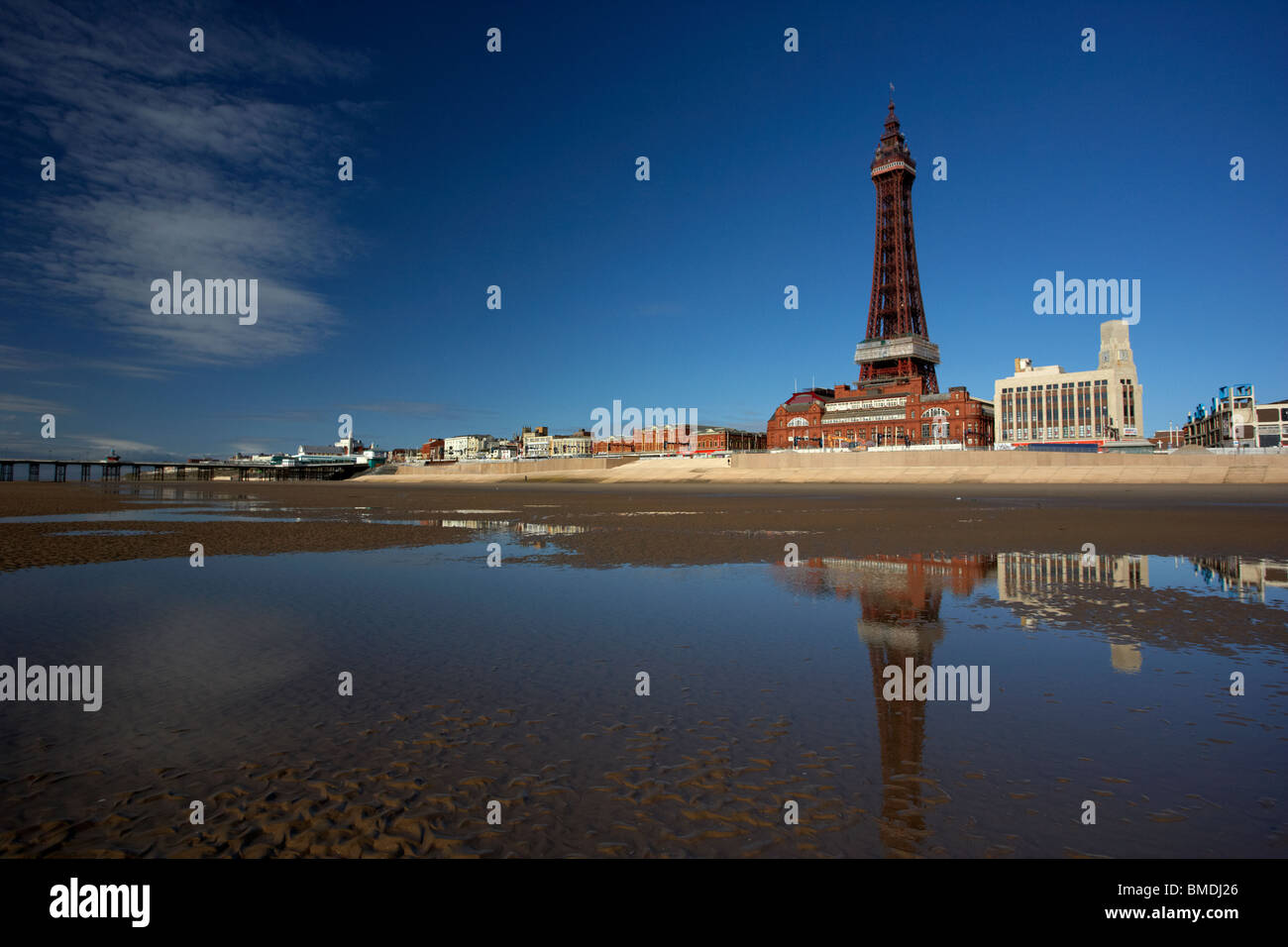reflection of Blackpool tower and seafront promenade in pool on the ...