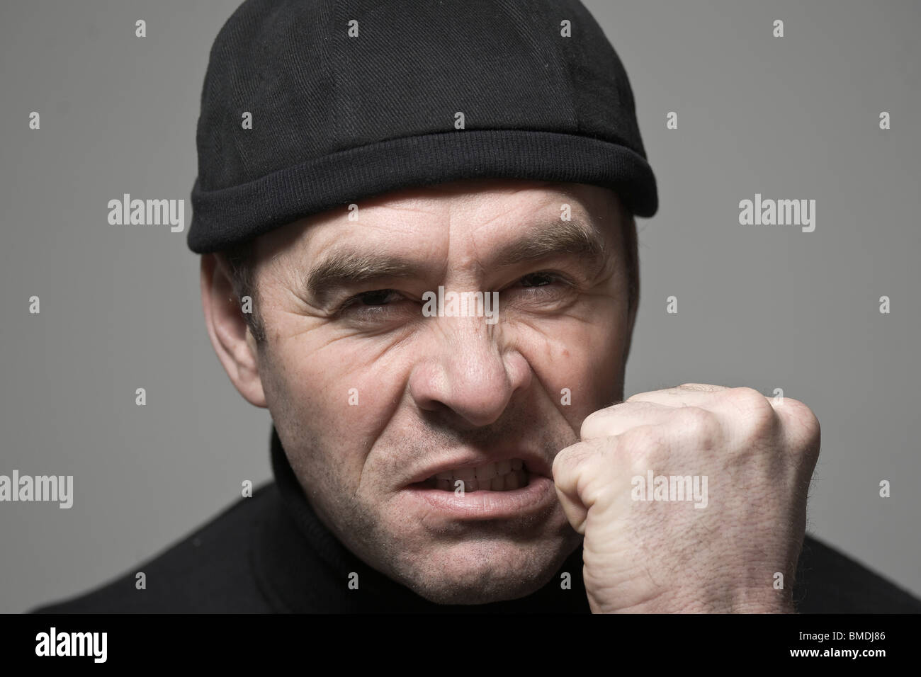 Angry Man Making a Fist Stock Photo - Alamy