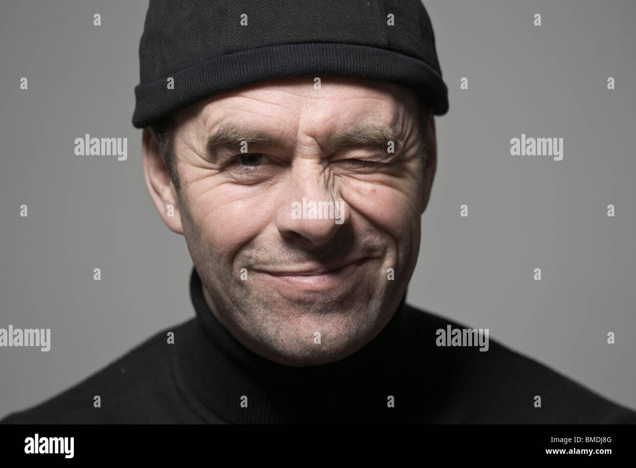 Portrait of Man Winking Stock Photo - Alamy
