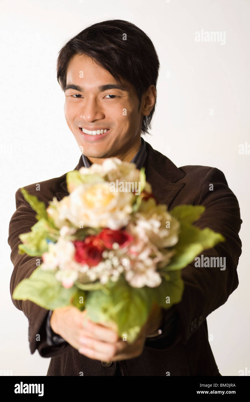 Man Holding Bouquet of Flowers Stock Photo - Alamy