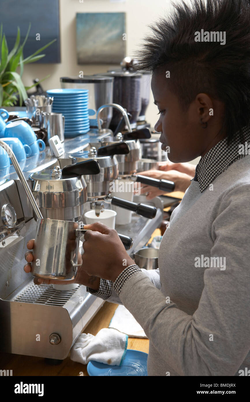Female employee making coffee drinks hi-res stock photography and ...