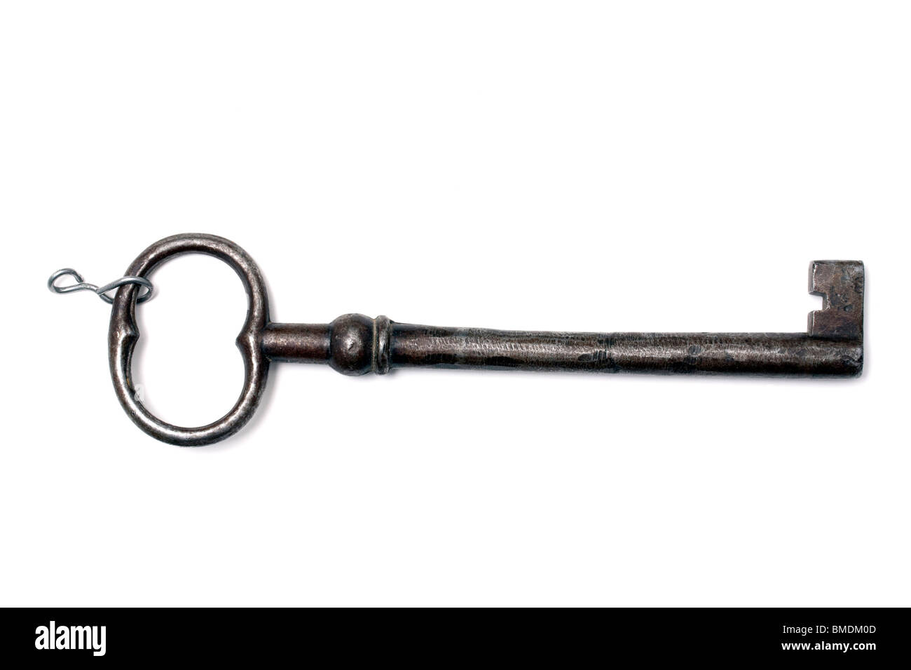 An old key isolated on white background Stock Photo - Alamy