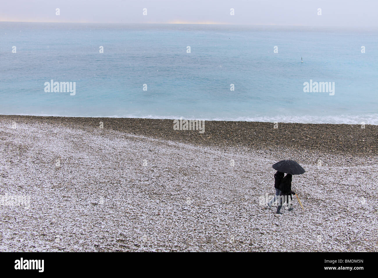 Snowed beach in winter time in Nice city. Snow in French Riviera is ...