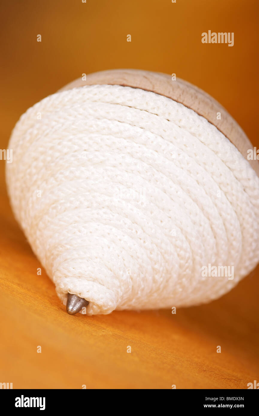 A peg top with white cord Stock Photo - Alamy