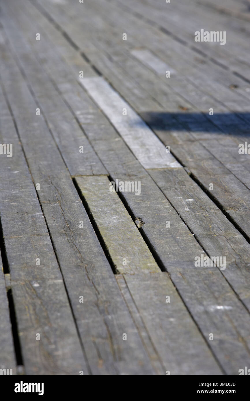 long wooden planks and repaired sections of an old victorian pier in ...