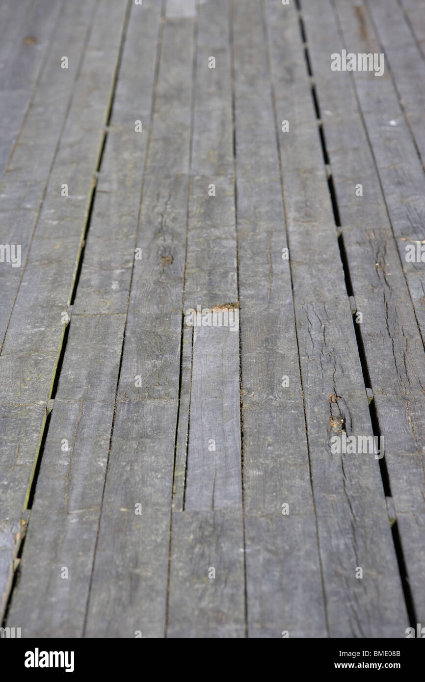 long wooden planks and repaired sections of an old victorian pier in ...