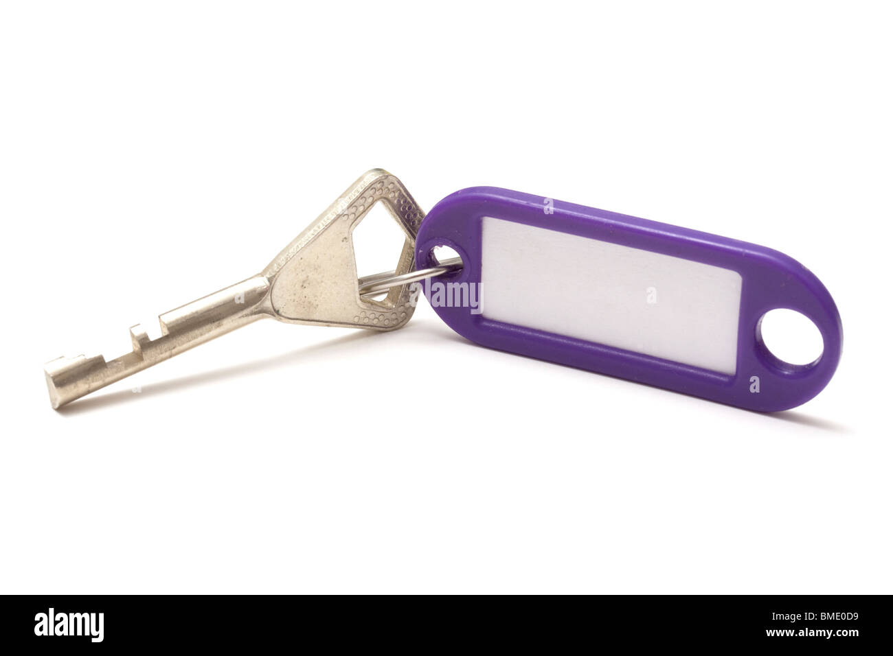Blank tag and key in isolated white Stock Photo - Alamy