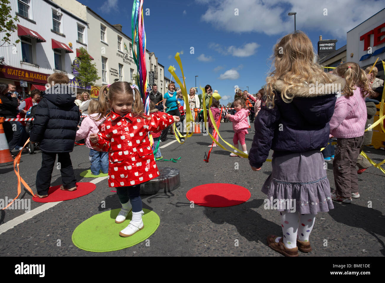 children dancing around a mini maypole on may day in holywood county ...