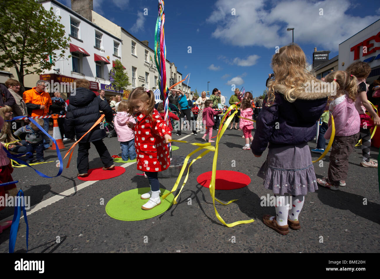 children dancing around a mini maypole on may day in holywood county ...