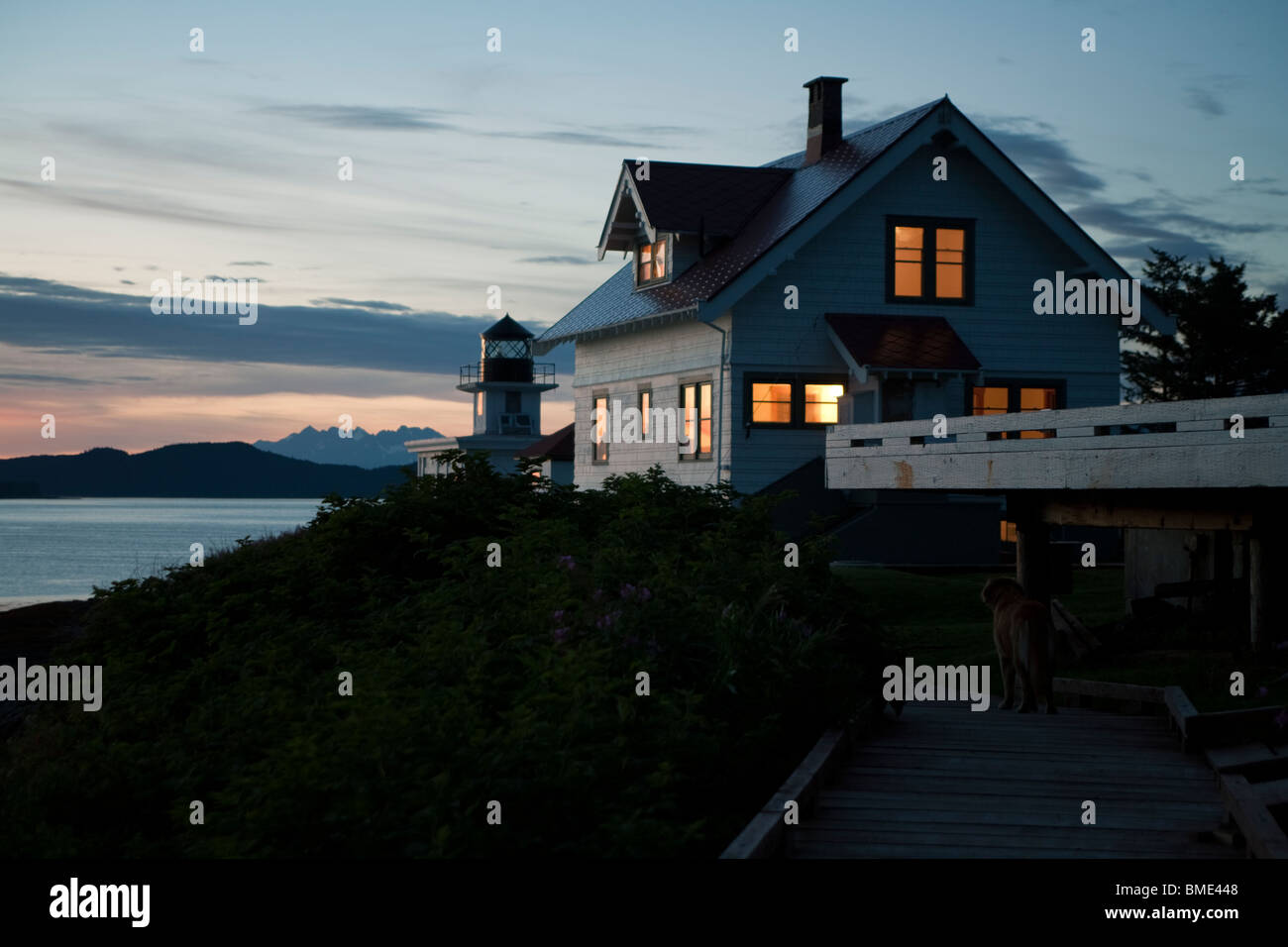 The Point Retreat lighthouse and keepers cottage at sunset on Admiralty ...