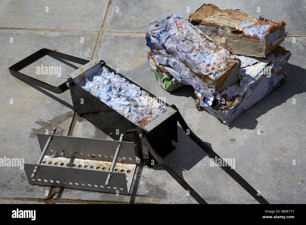 recycling old unrecyclable envelopes and paper into paper bricks to be ...