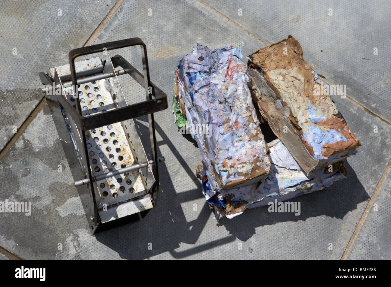 recycling old unrecyclable envelopes and paper into paper bricks to be ...