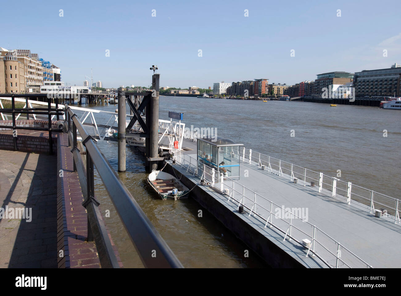 People waiting at the St Katherine Pier river bus stop in the City of ...