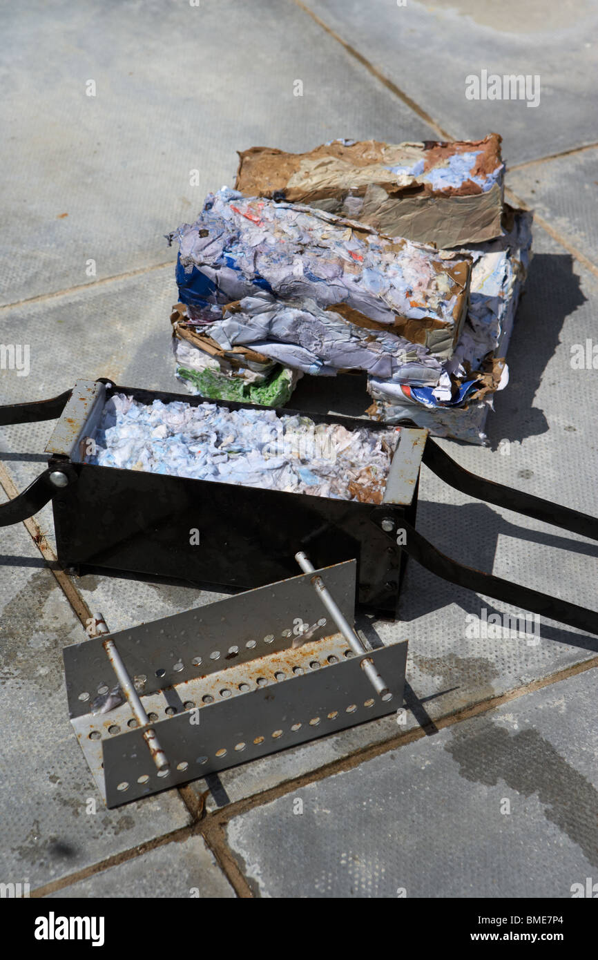 recycling old unrecyclable envelopes and paper into paper bricks to be ...