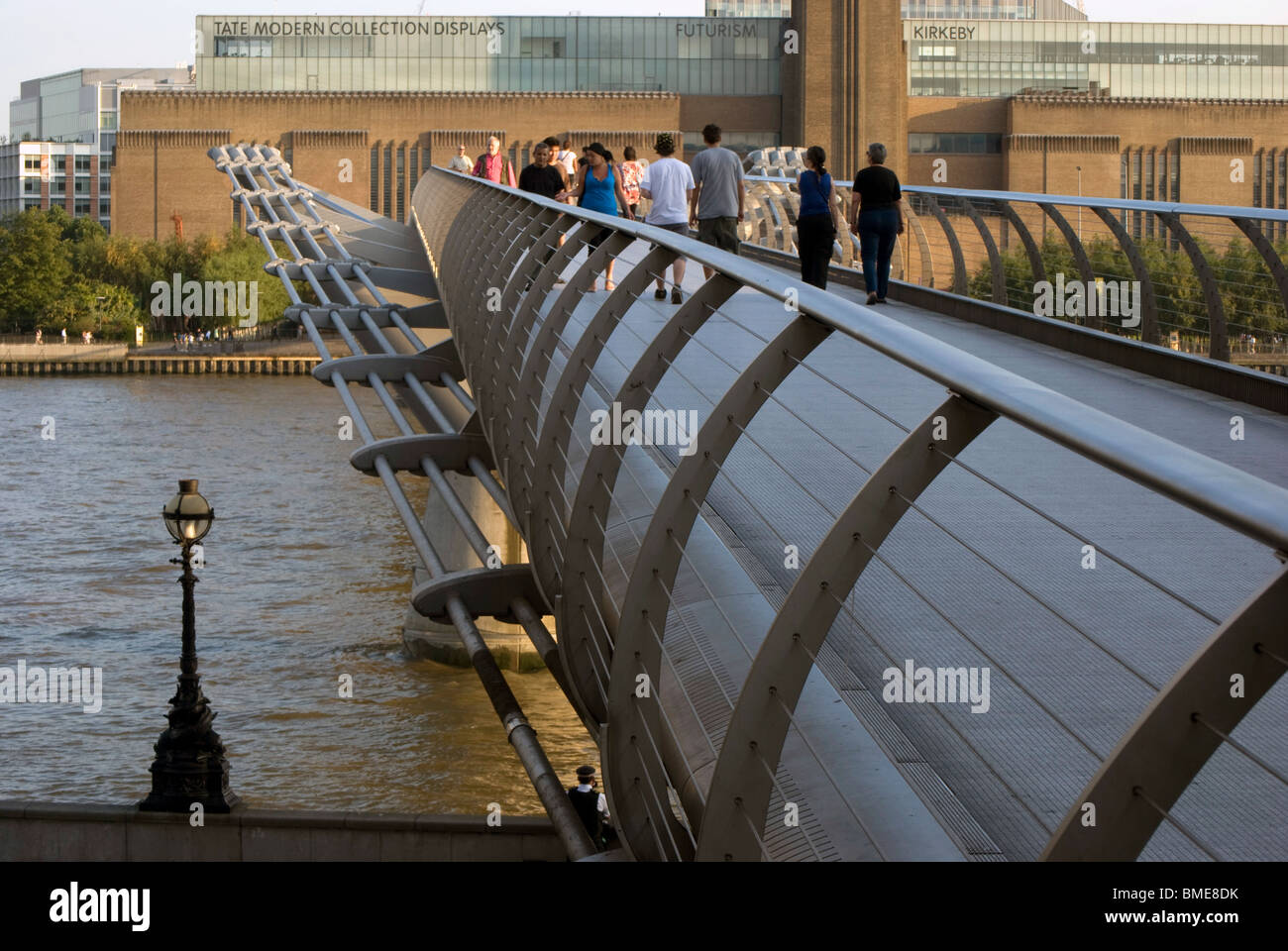 People crossing the Millennium Bridge in the City of London Stock Photo ...