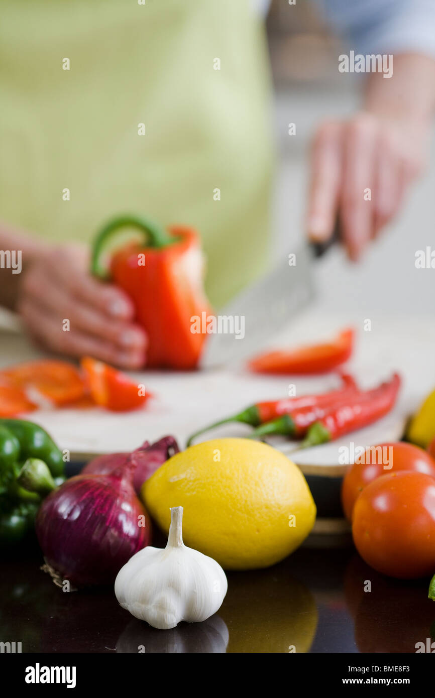 Woman cutting up vegetables, Sweden Stock Photo - Alamy
