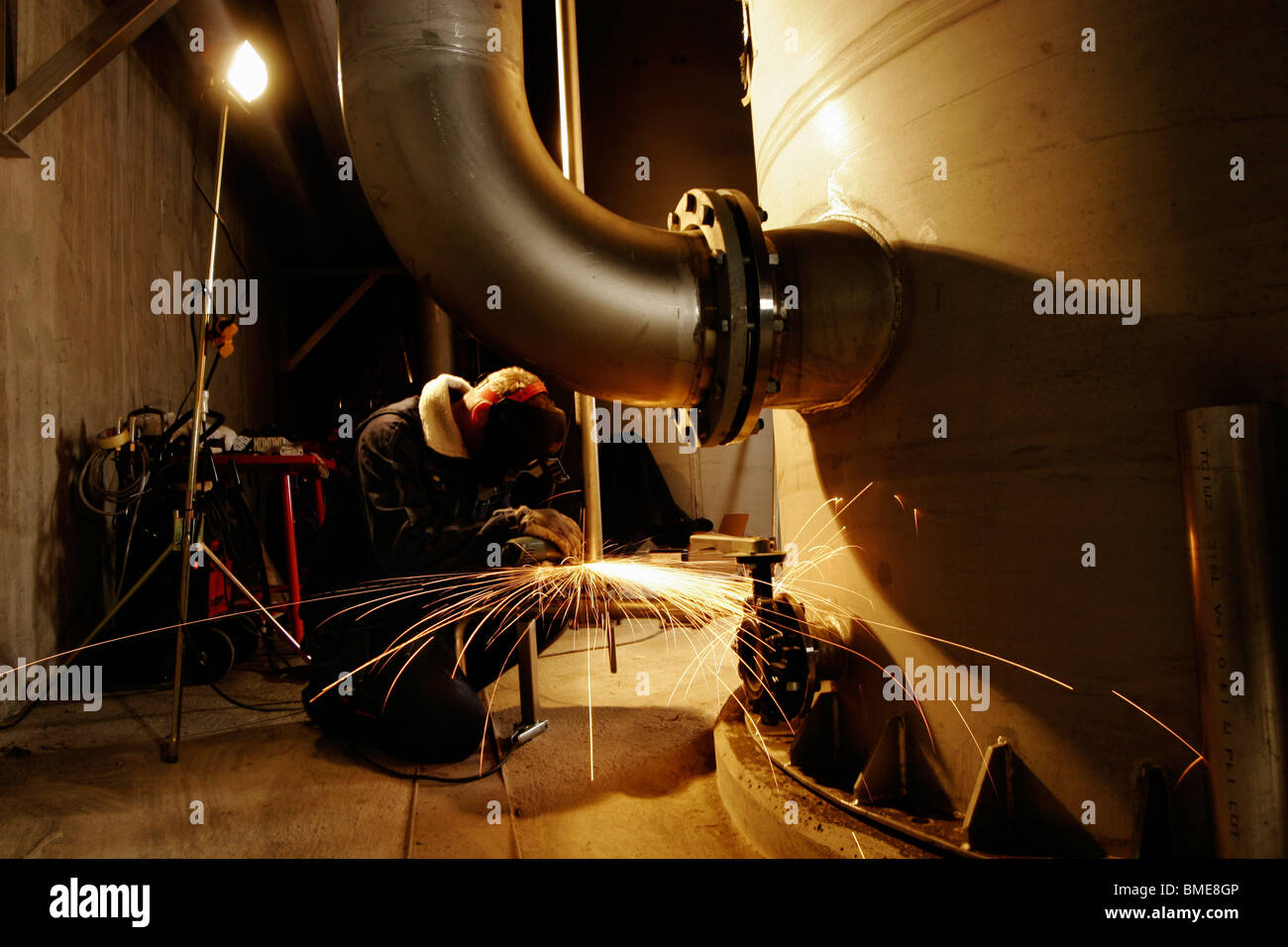 Man working with welding machine Stock Photo - Alamy