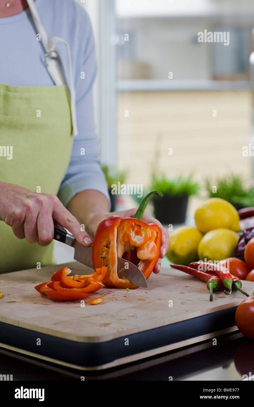 Woman cutting up vegetables, Sweden Stock Photo - Alamy