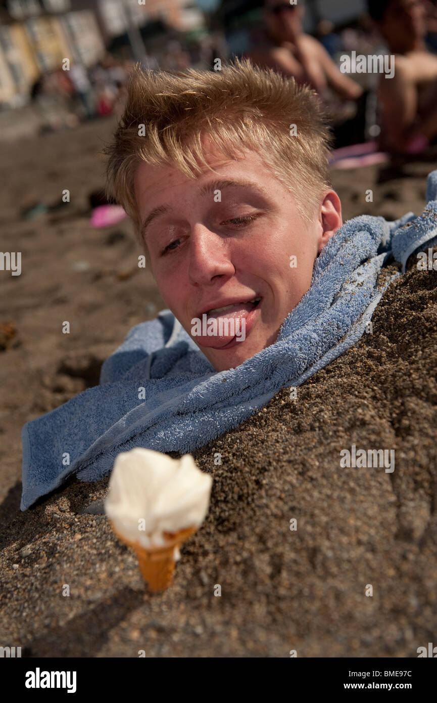 Buried up to neck in sand hi-res stock photography and images - Alamy