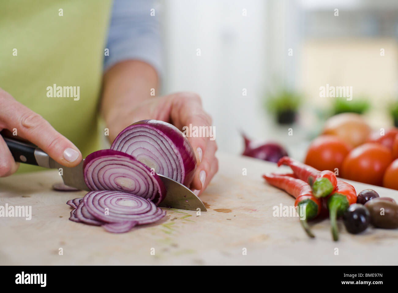 Woman cutting up vegetables, Sweden Stock Photo - Alamy