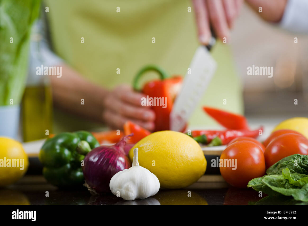 Woman cutting up vegetables, Sweden Stock Photo - Alamy