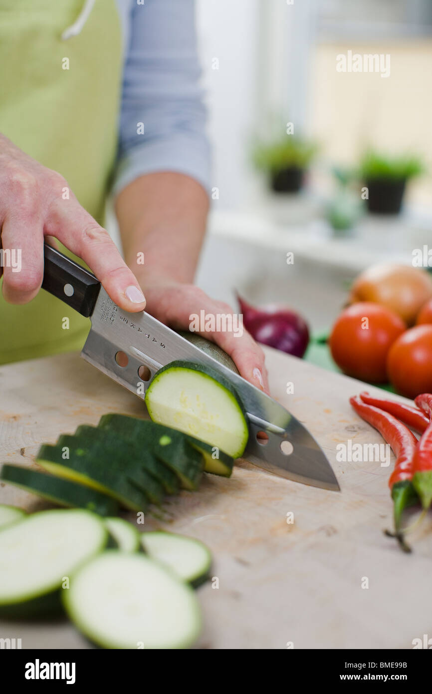 Woman cutting up vegetables, Sweden Stock Photo - Alamy