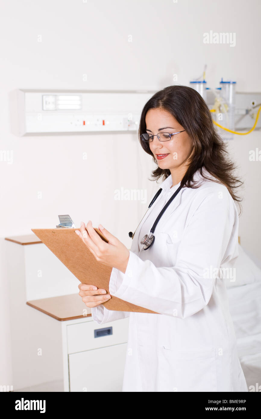 female doctor or nurse working in hospital ward Stock Photo - Alamy
