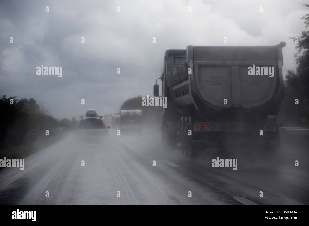 Rain weather on highway Stock Photo - Alamy