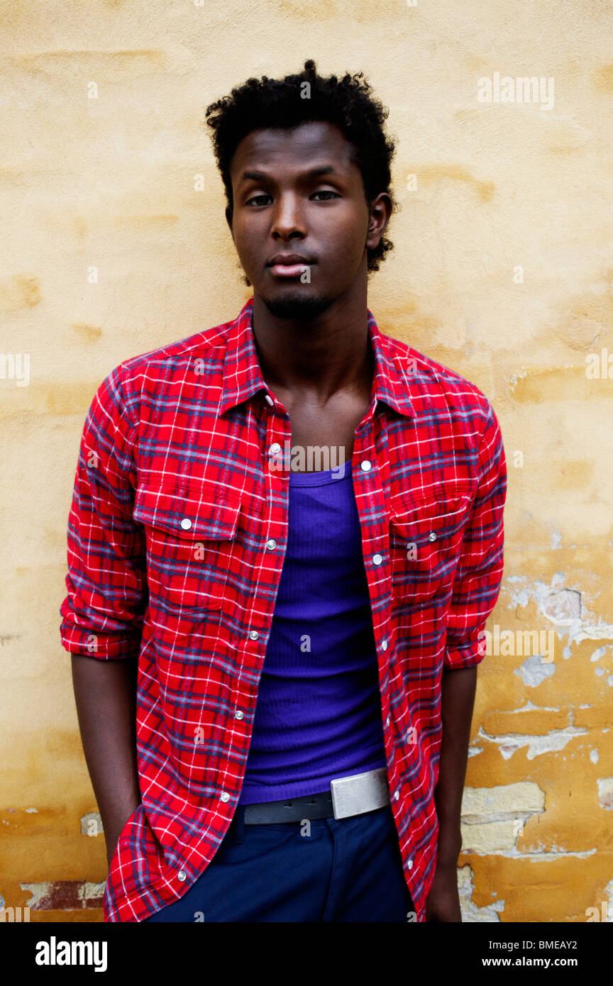 Young man staring at camera Stock Photo - Alamy