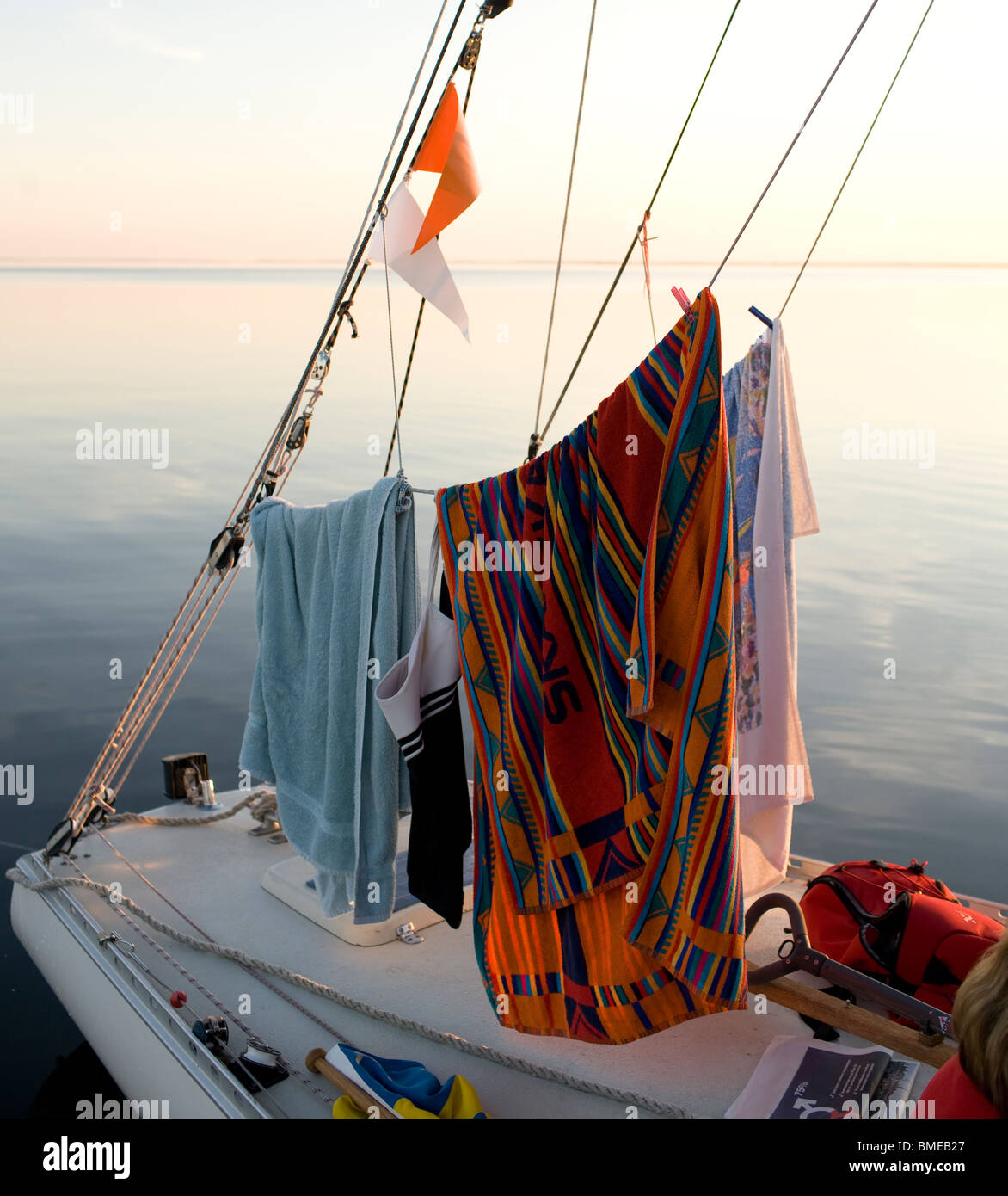 Towels hanging on rope Stock Photo - Alamy