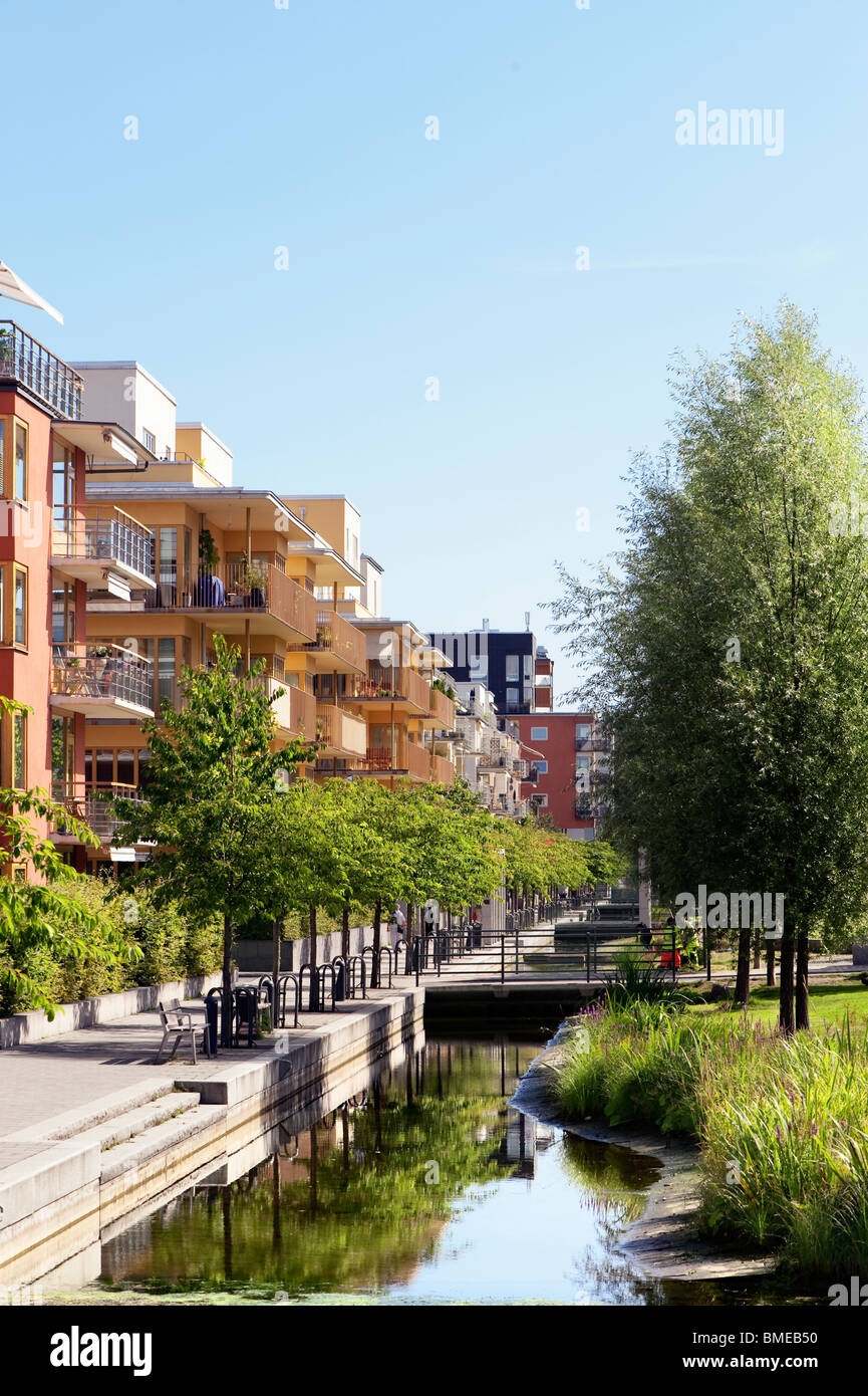 Reflection of buildings and tree in canal Stock Photo - Alamy