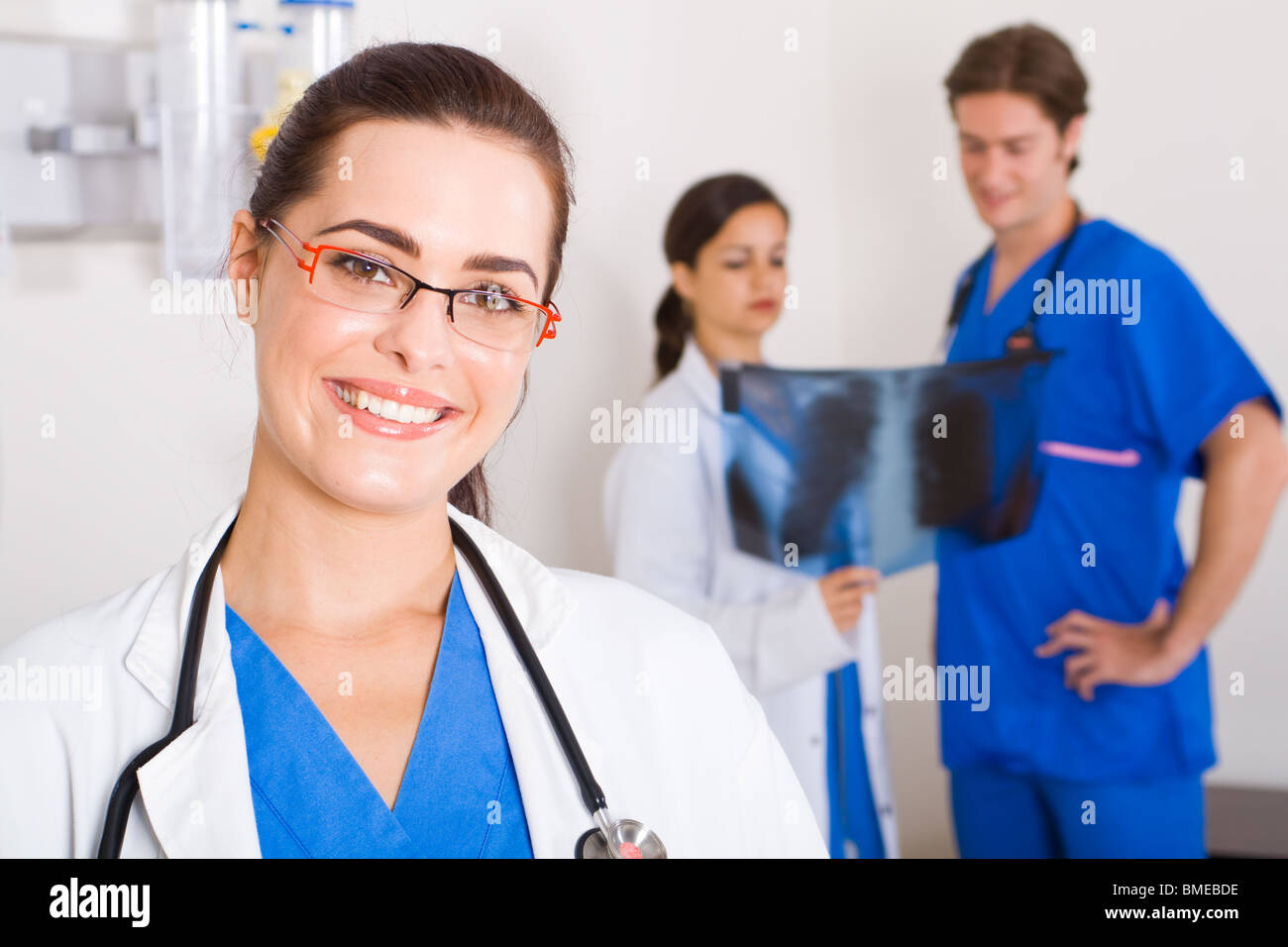 beautiful young health care workers in hospital, background is her ...