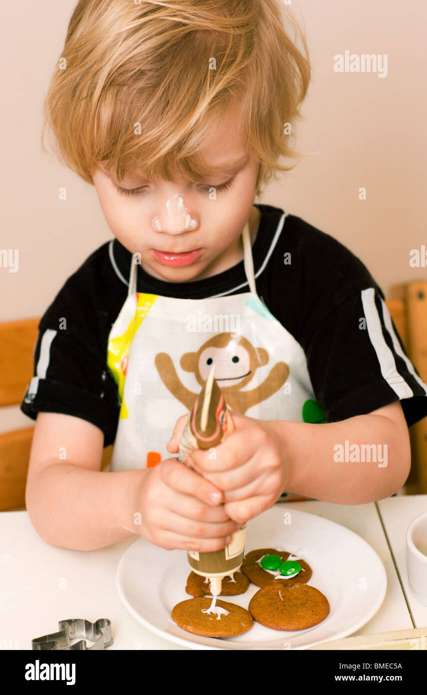 Boy preparing cookies Stock Photo - Alamy