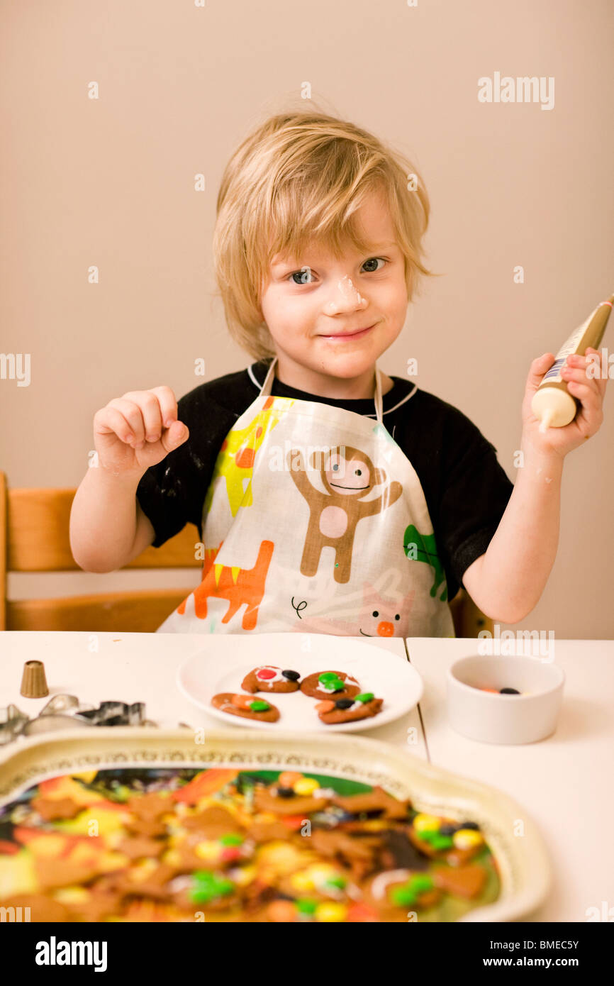 Cute boy making cookie hi-res stock photography and images - Alamy
